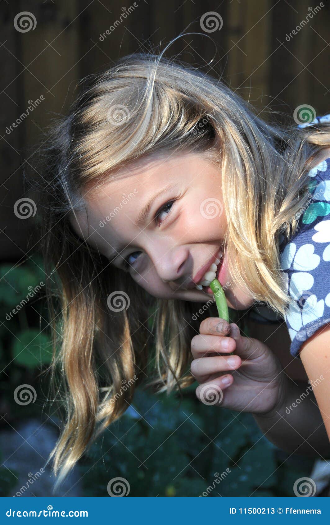Girl in a Garden Eating a String Bean Stock Image - Image of face ...