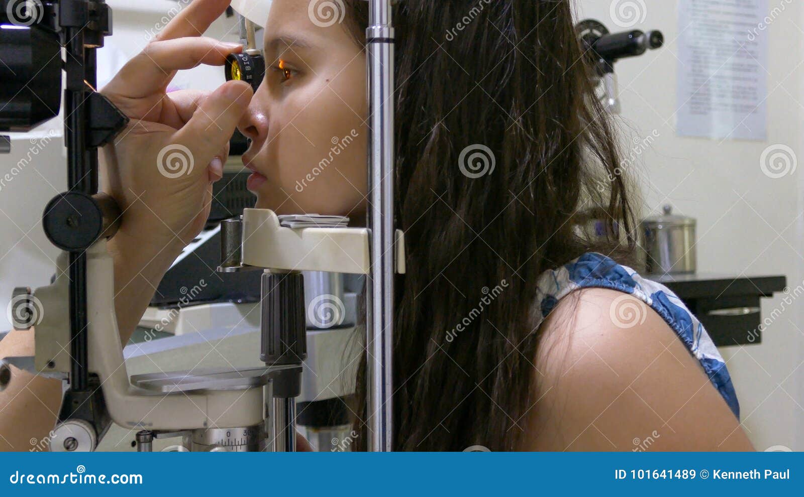 Girl getting eyes tested stock image. Image of examination - 101641489