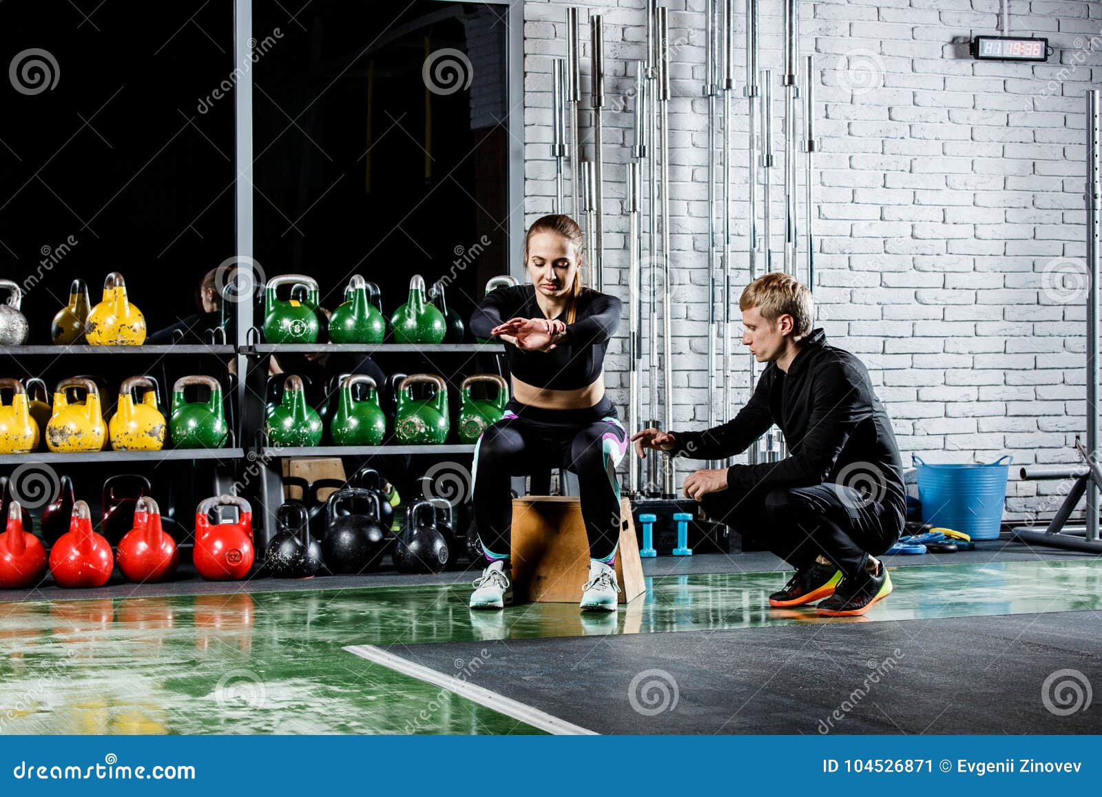 The Girl is Getting Ready for the Exercise with the Trainer Stock Image ...