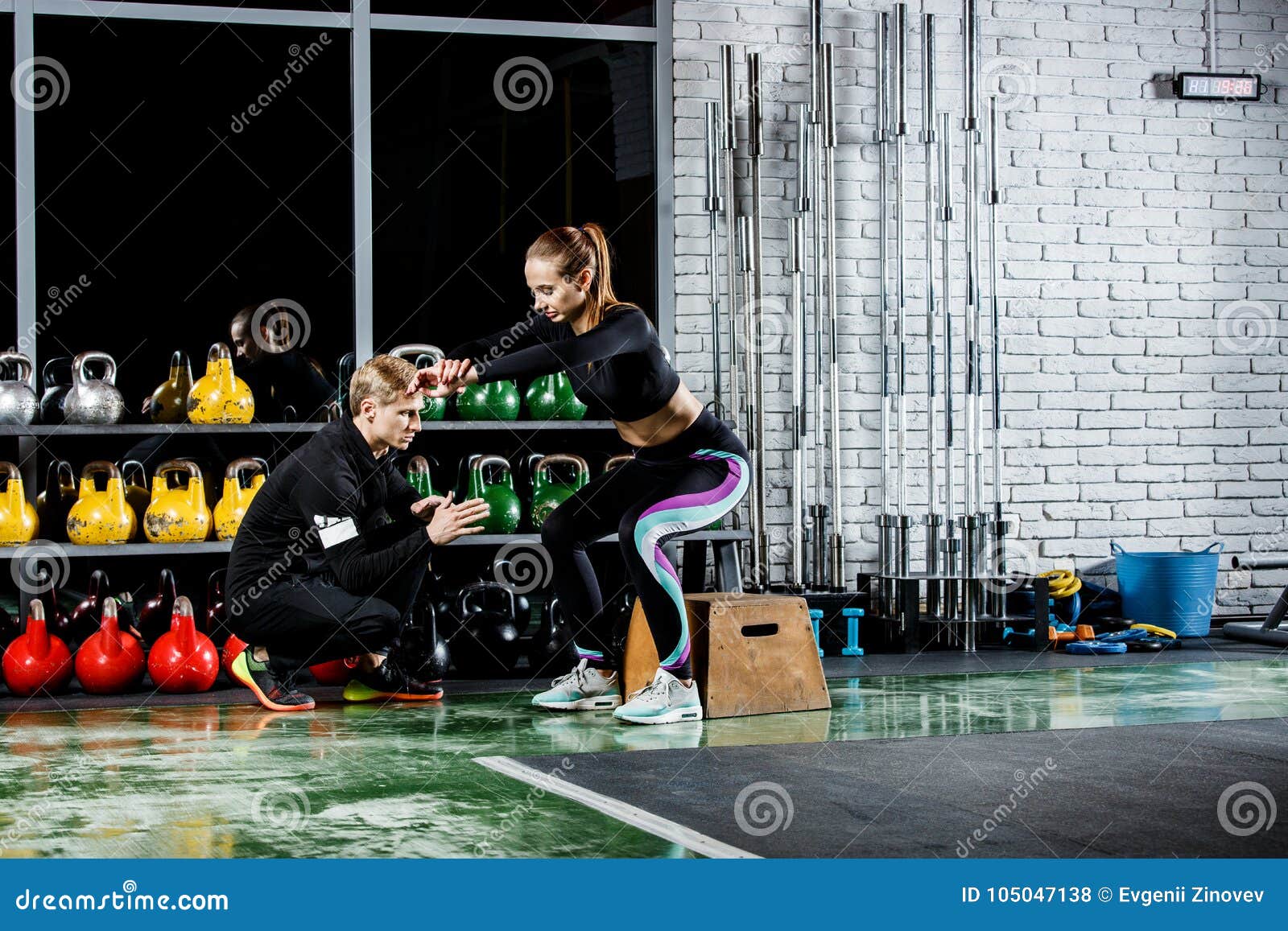 The Girl is Getting Ready for the Exercise with the Trainer Stock Photo ...