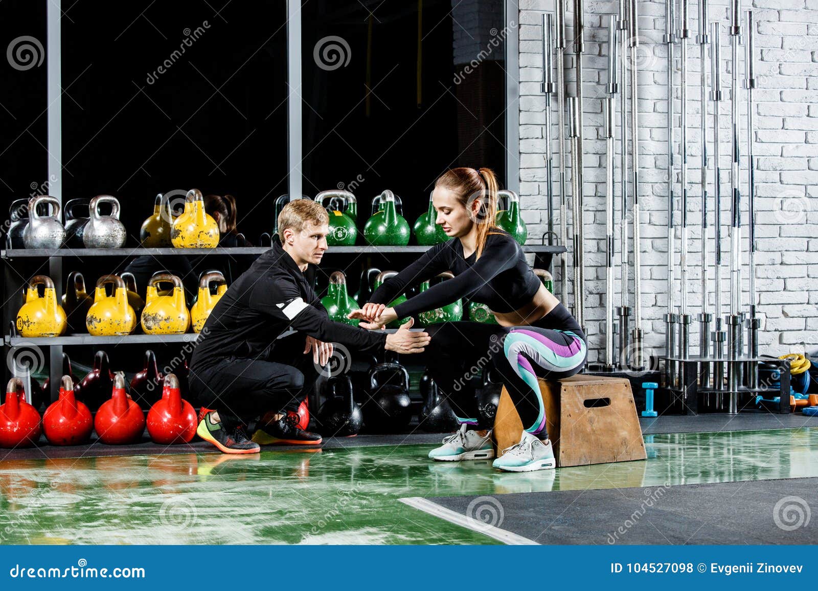 The Girl is Getting Ready for the Exercise with the Trainer Stock Photo ...