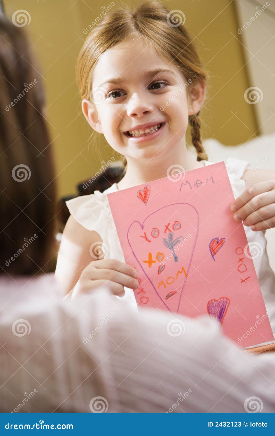 Girl giving mom a drawing. stock image. Image of gift - 2432123