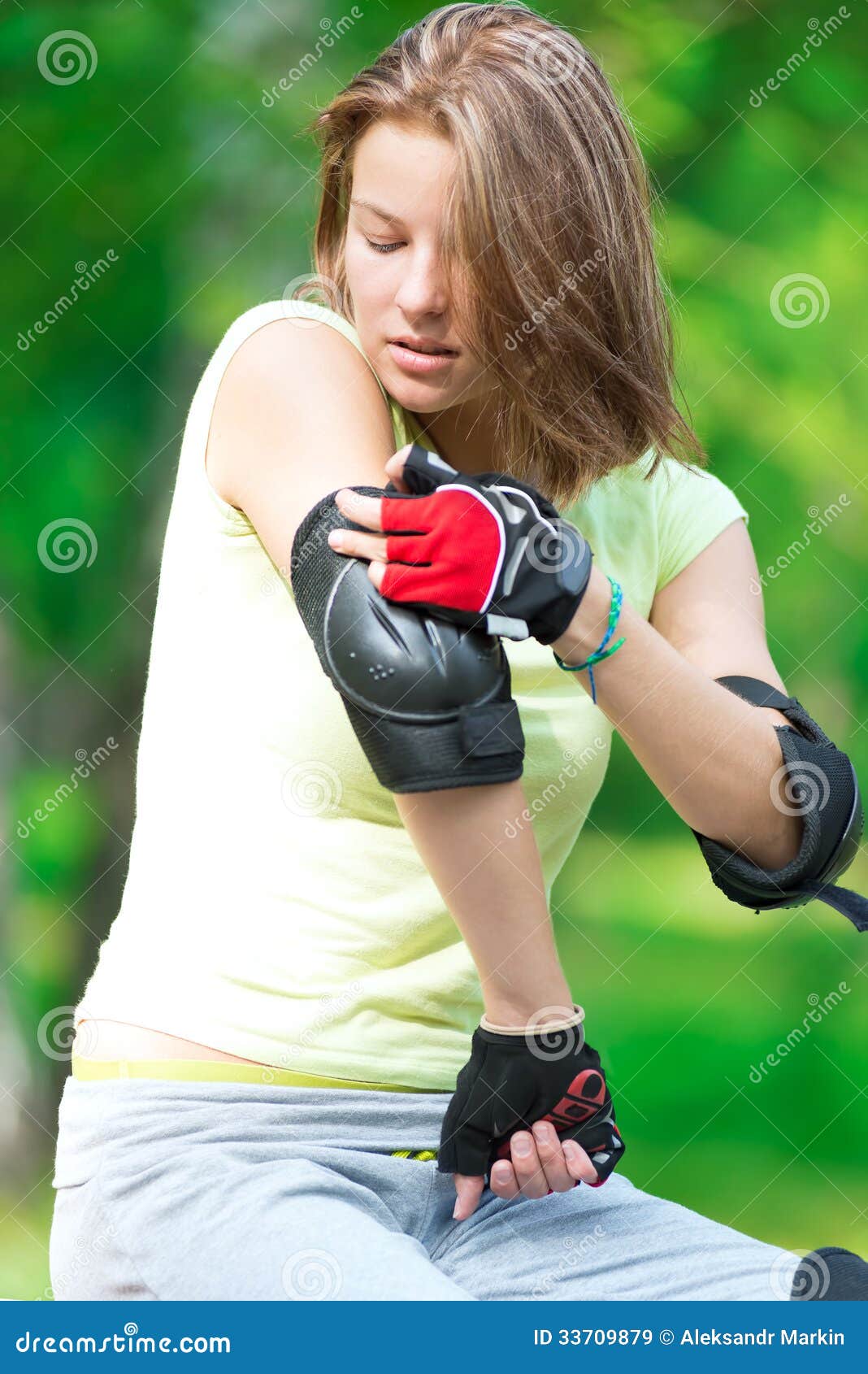 Girl Going Rollerblading Sitting in Bench Putting on Elbow Guard Stock ...