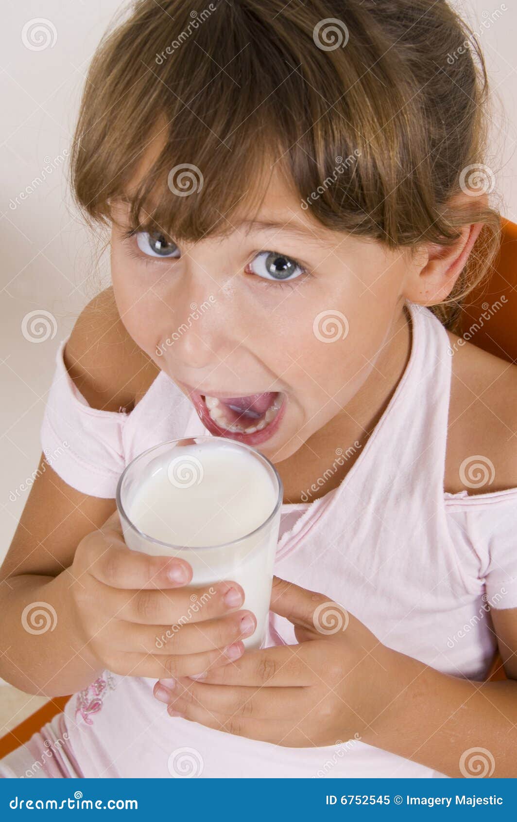 Girl going to drink milk stock image. Image of childhood - 6752545