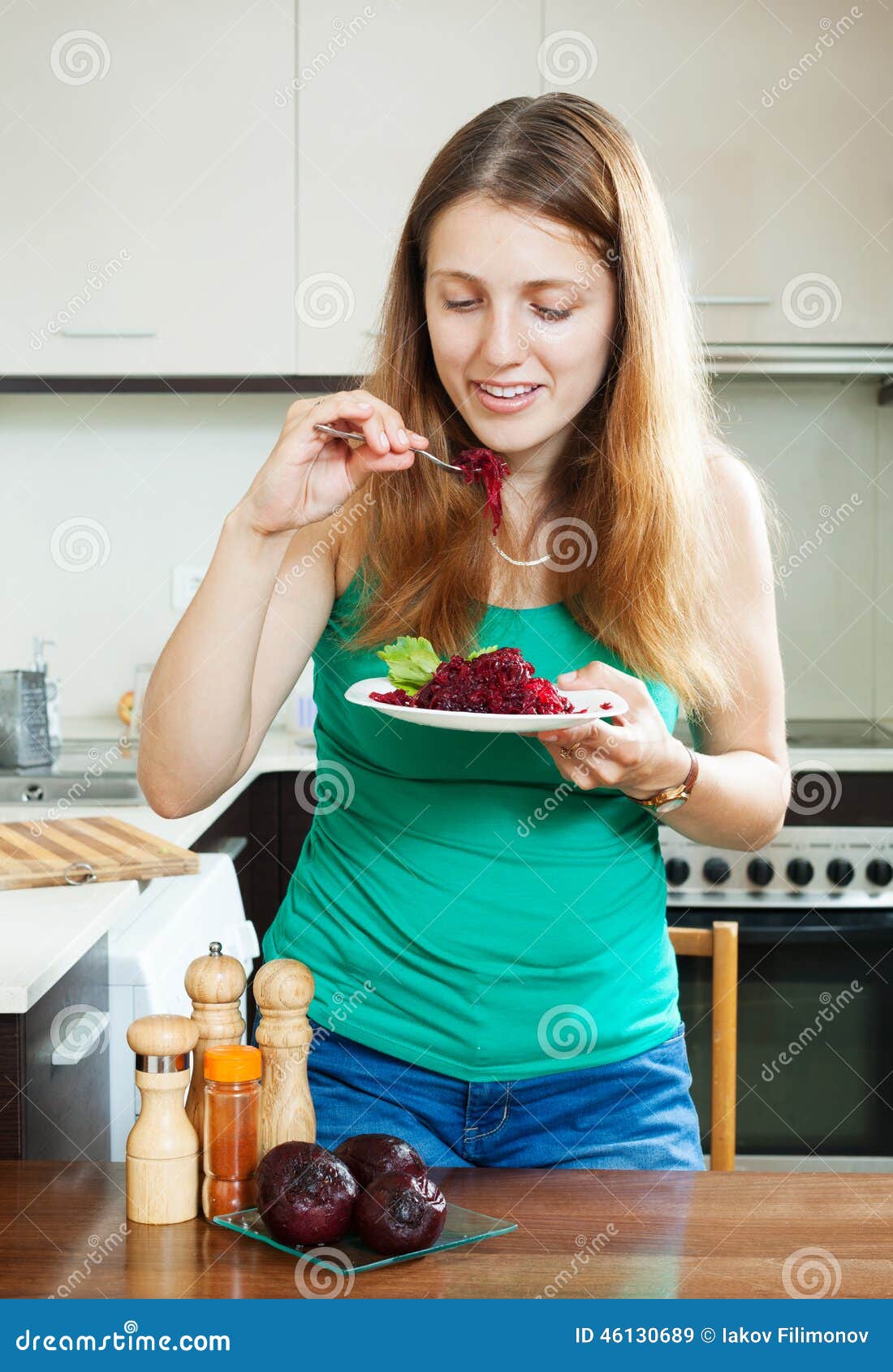 Girl in green eating beets stock image. Image of breakfast - 46130689