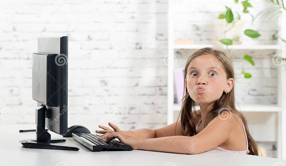 A Girl Grimaced Front of a Computer Stock Photo - Image of childhood ...