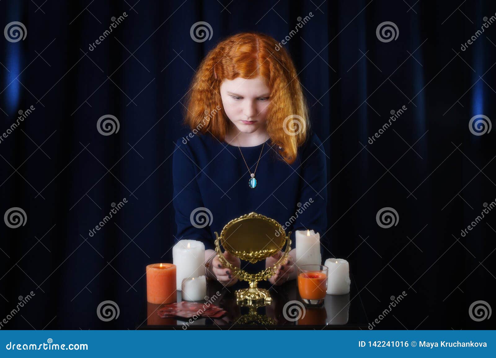 Girl Guessing with a Mirror on Blue Background Stock Photo - Image of ...