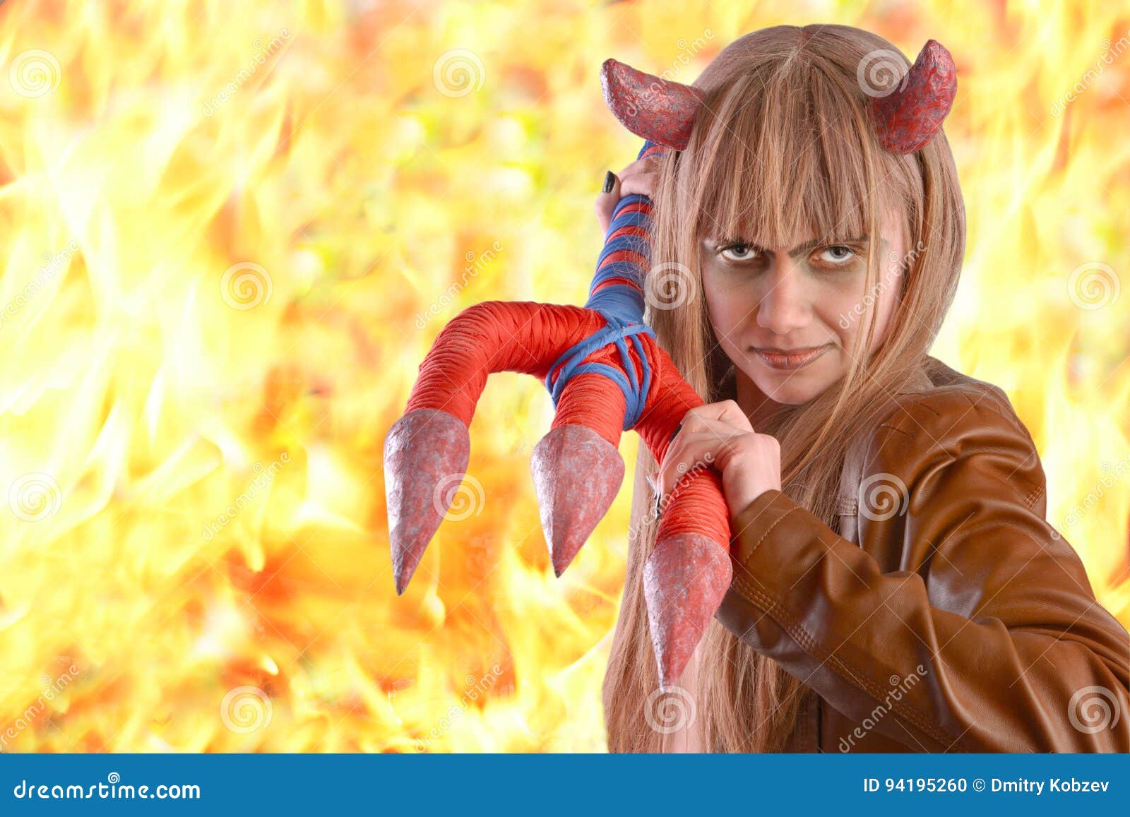Girl in the Guise of a Devil on the Background of Fire Stock Photo ...