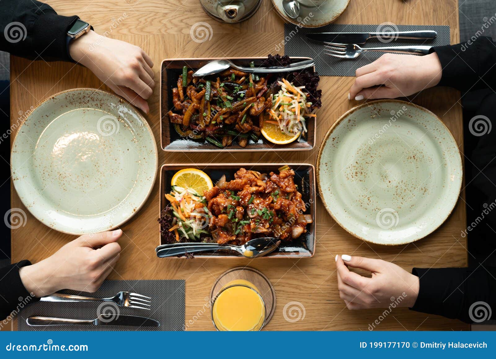 A Girl and a Guy at the Table are Having Dinner or Lunch in an Asian ...