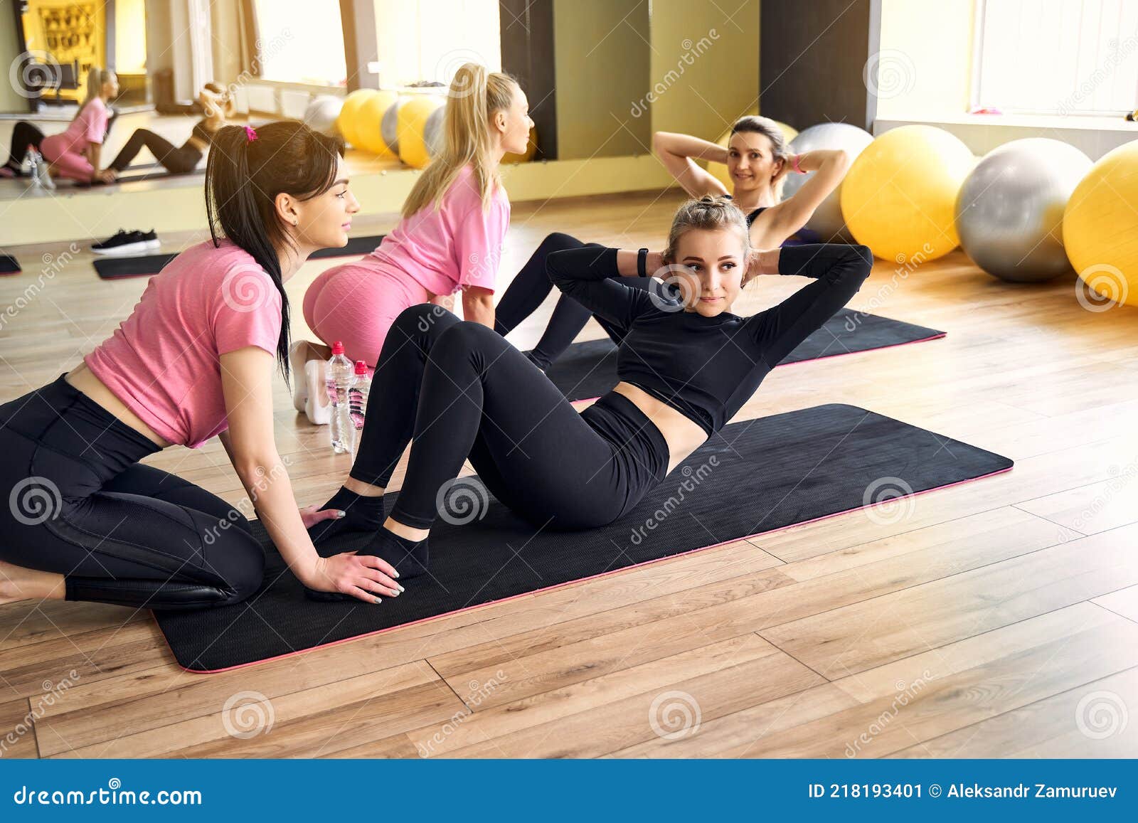 Girl in the Gym Doing Exercises for the Press, Teamwork Stock Image ...