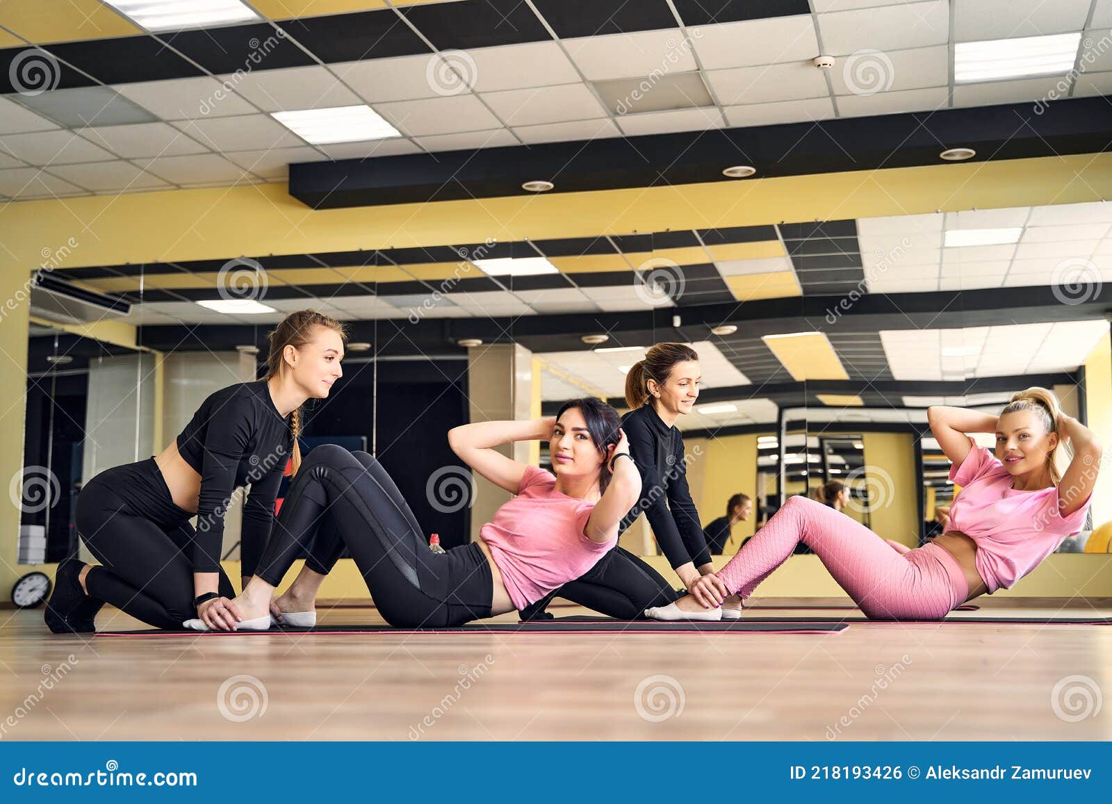 Girl in the Gym Doing Exercises for the Press, Teamwork Stock Photo ...