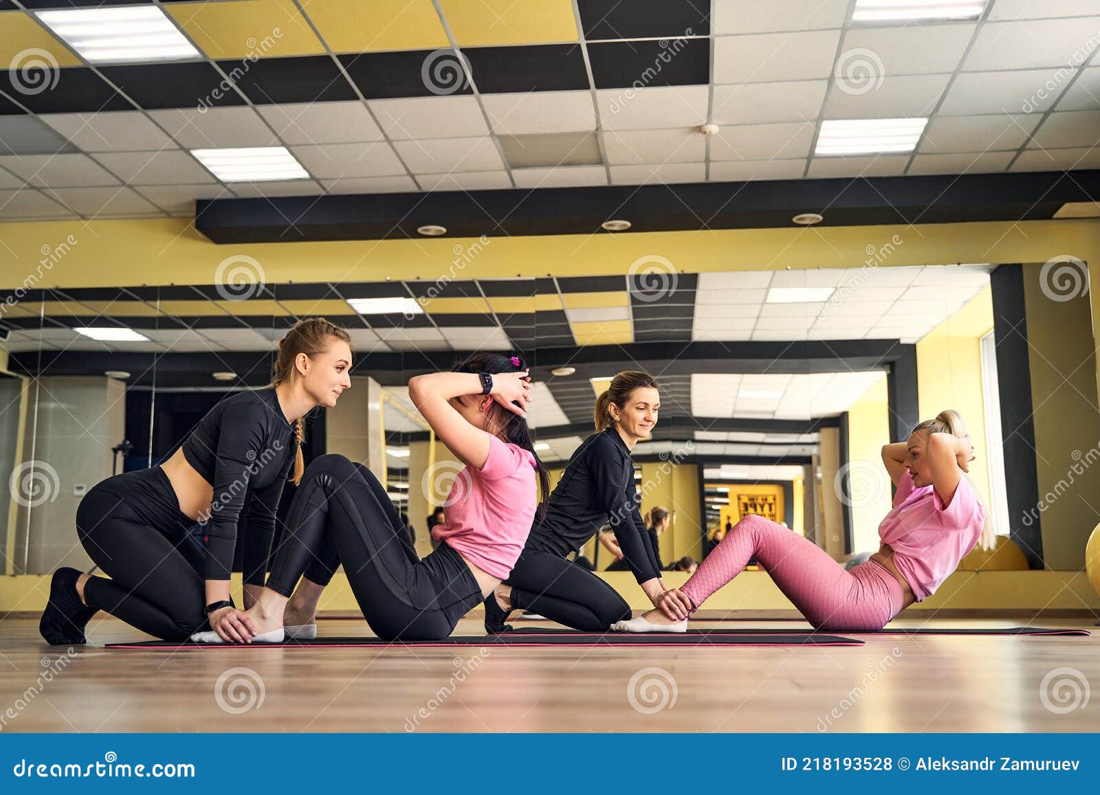 Girl in the Gym Doing Exercises for the Press, Teamwork Stock Photo ...
