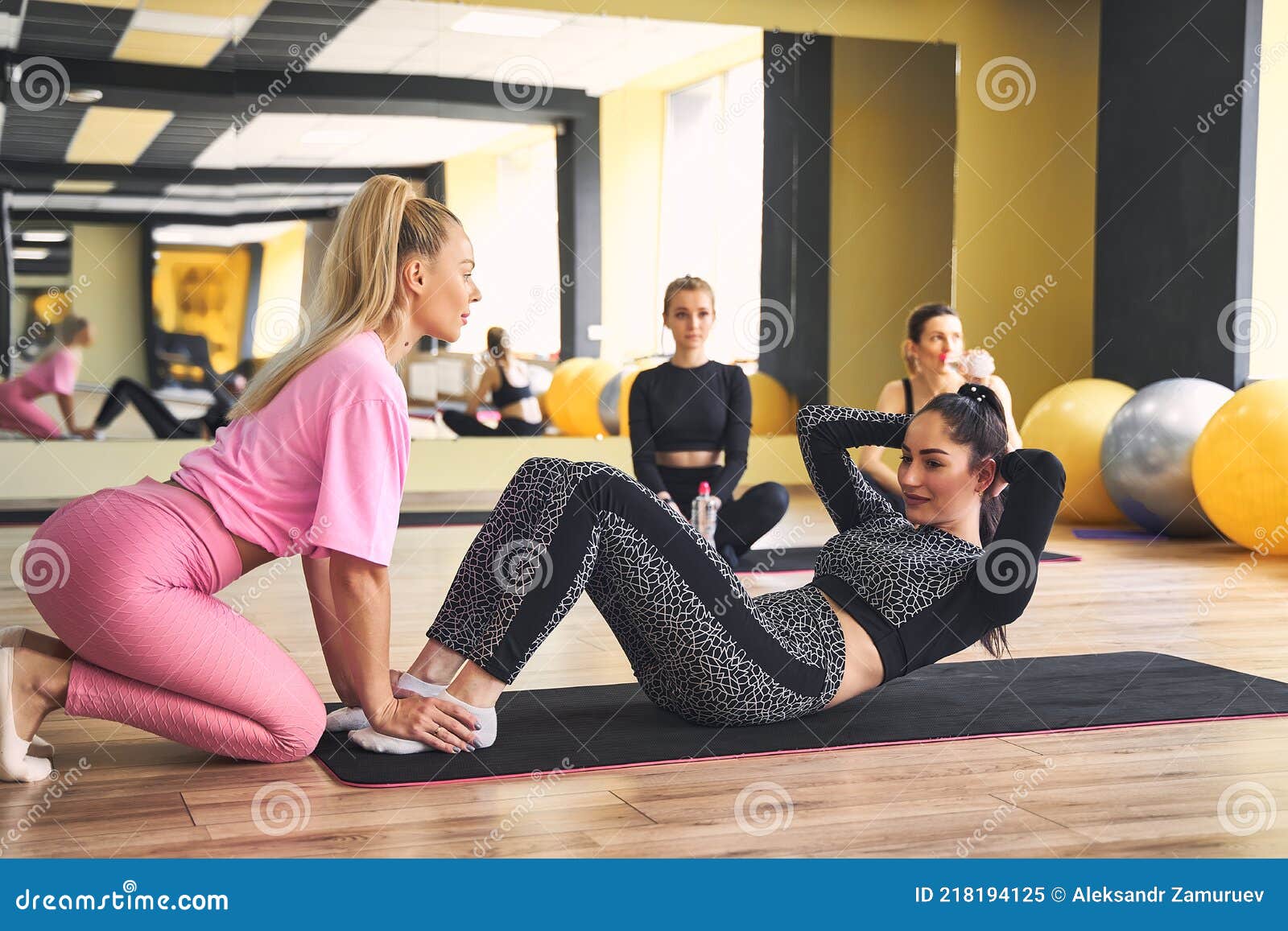 Girl in the Gym Doing Exercises for the Press, Teamwork Stock Image ...