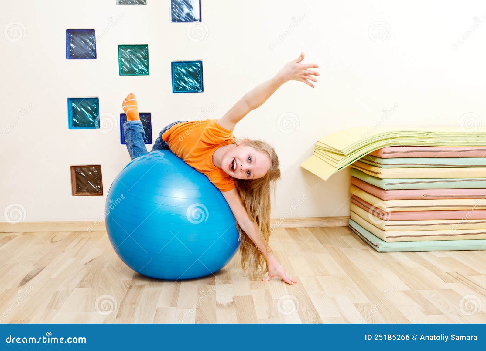 Girl on a gymnastic ball stock photo. Image of small - 25185266