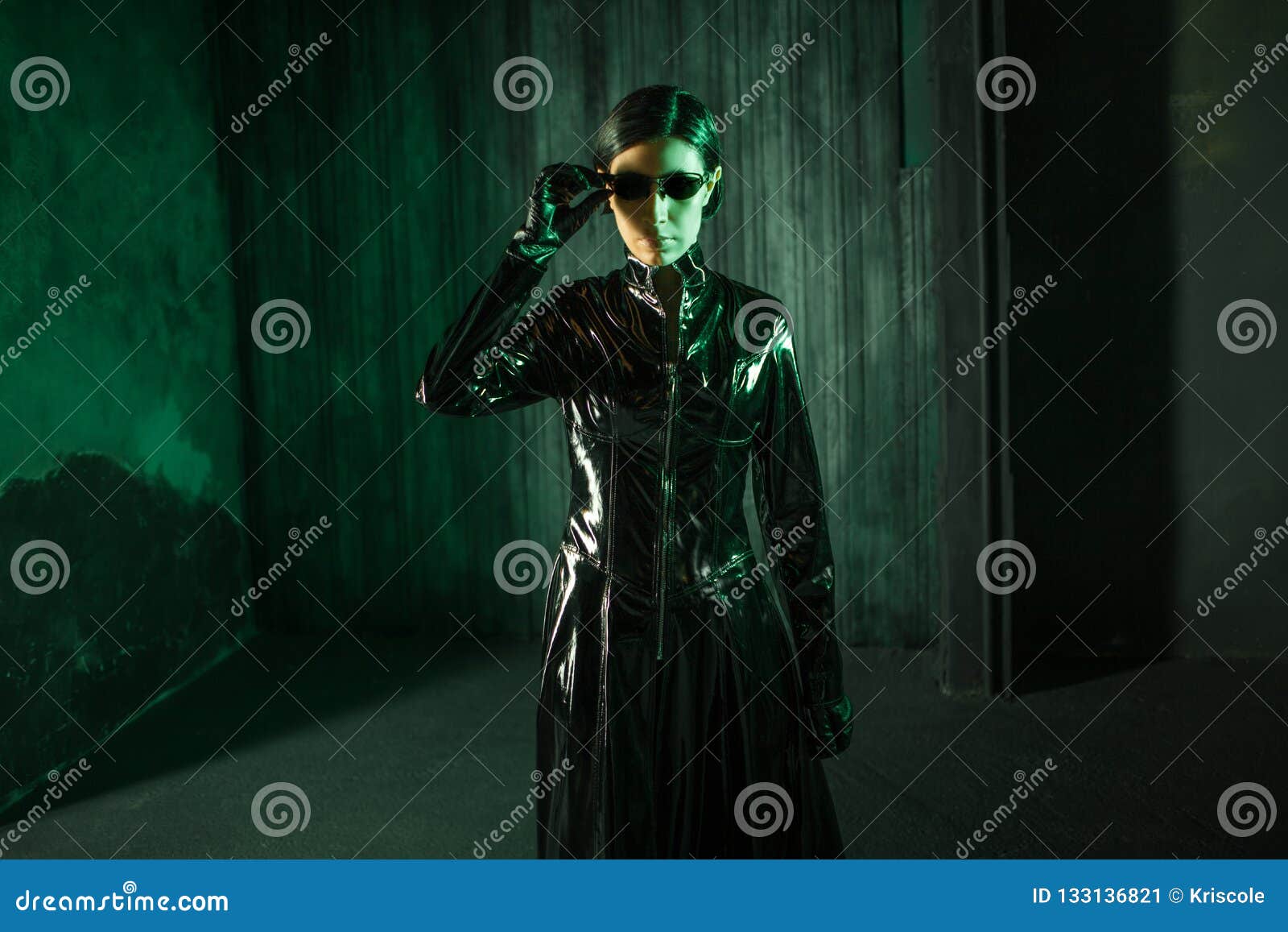 Girl Hacker In A Hood Typing Program Code While Committing A Cybercrime Hacking A System On The