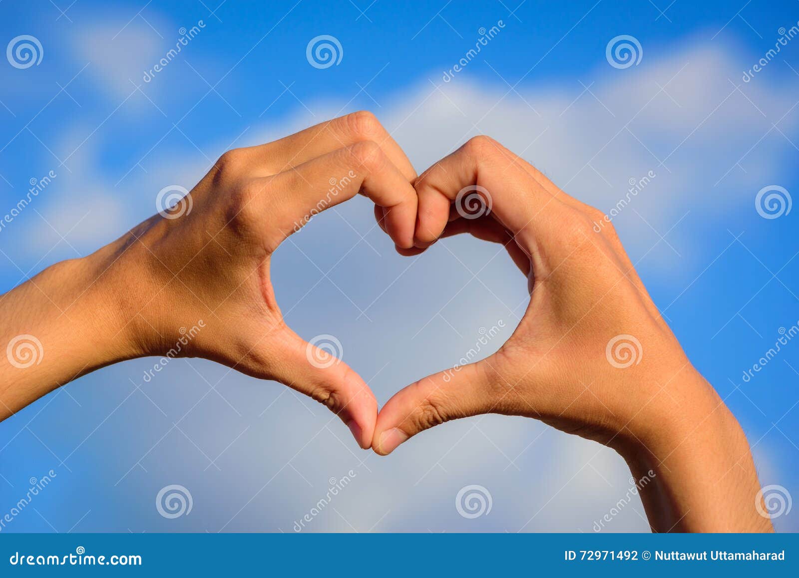 Girl Hands in Shape of Love Heart on Blue Sky Stock Photo - Image of ...