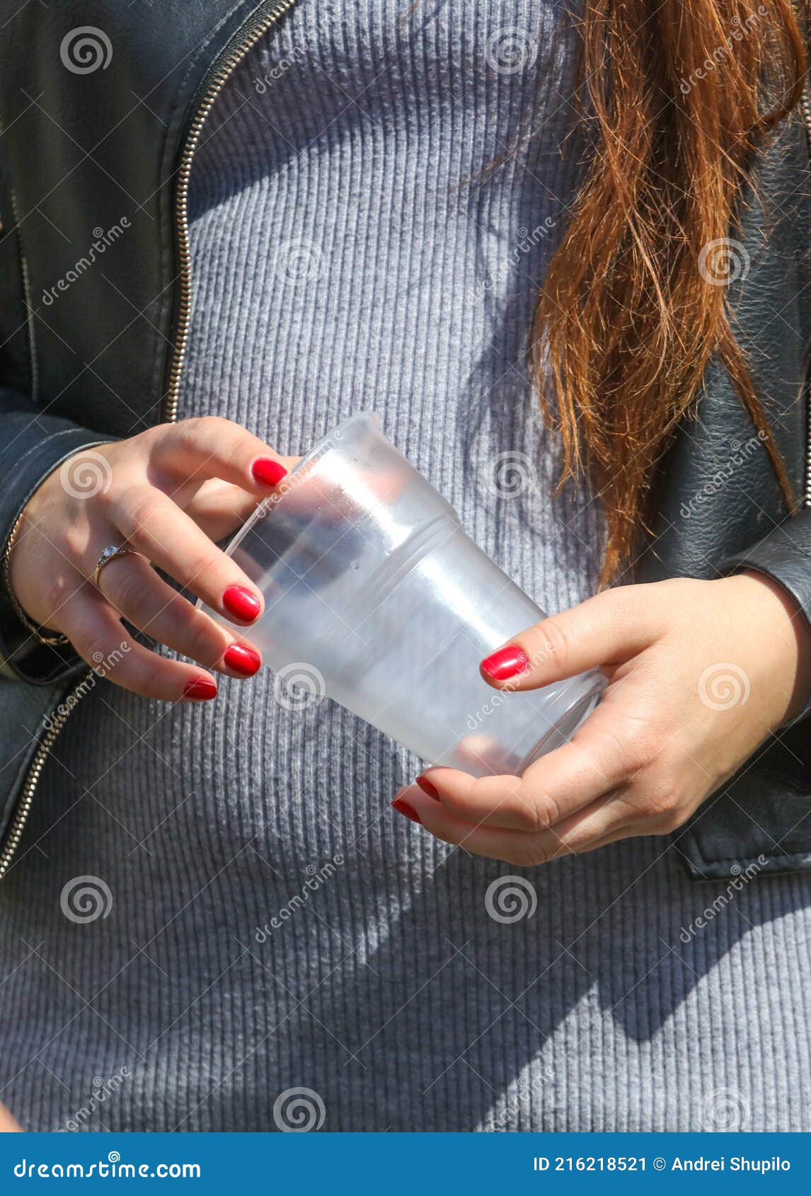 The Girl Has a Plastic Cup in Her Hand Stock Image - Image of human ...