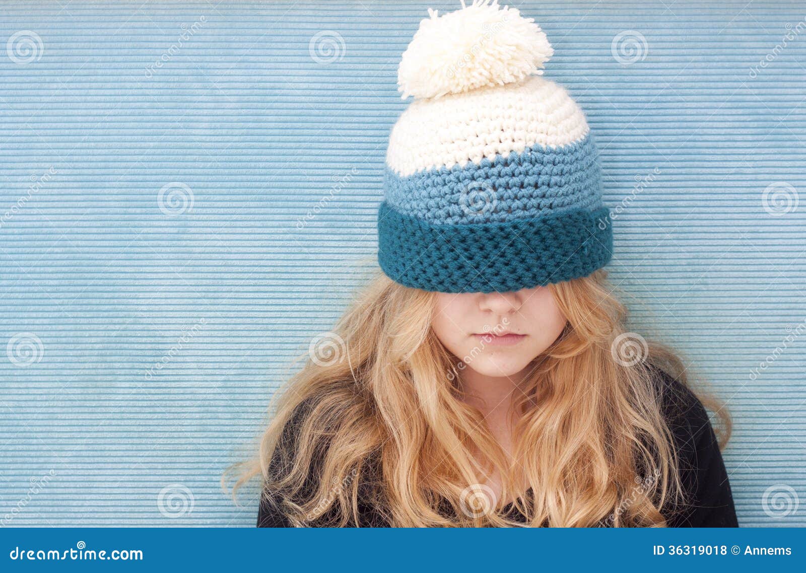 Girl with Hat Pulled Over Her Eyes Stock Photo - Image of hair, beanie ...