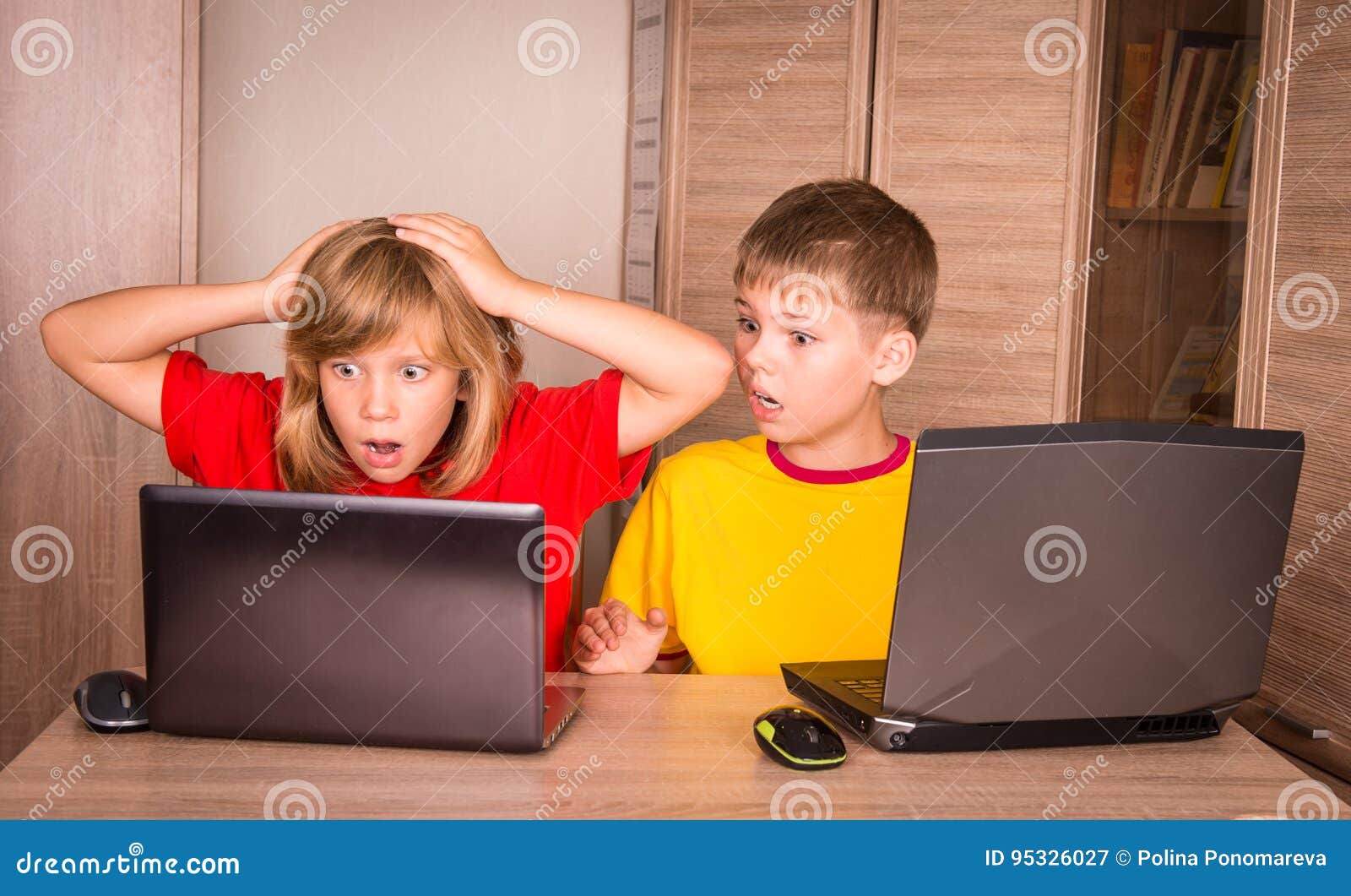 Girl Having a Computer Problem. Cute Children Using Laptops at H Stock ...