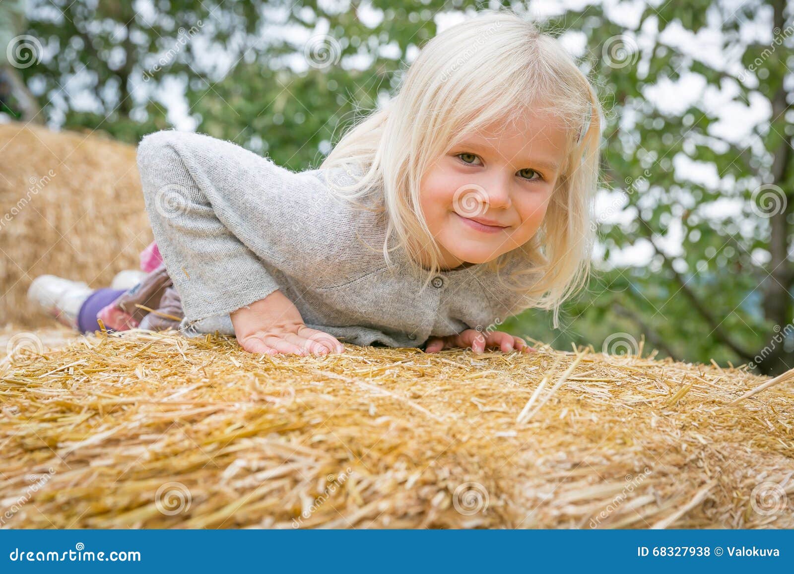Girl on haystack stock photo. Image of autumn, outdoor - 68327938