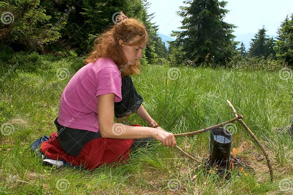 Girl heating the water stock image. Image of hike, scout - 2116677