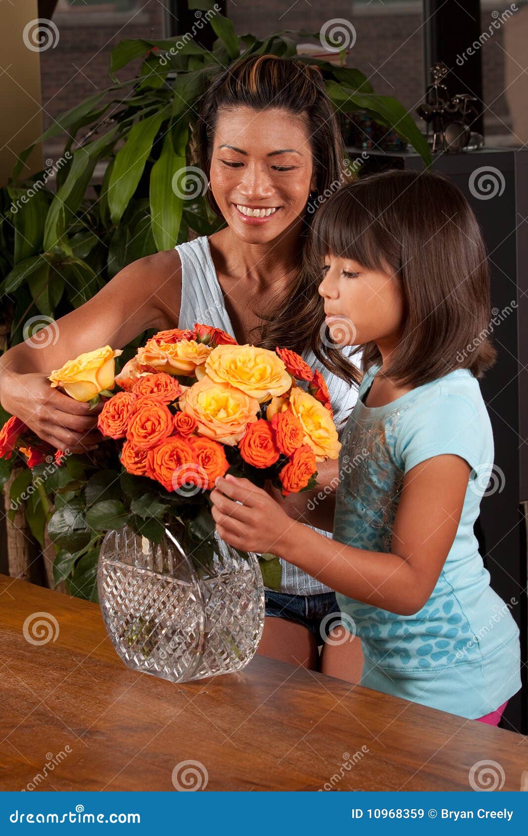 Girl Helping Mom with Flowers Stock Image - Image of colorful, face ...