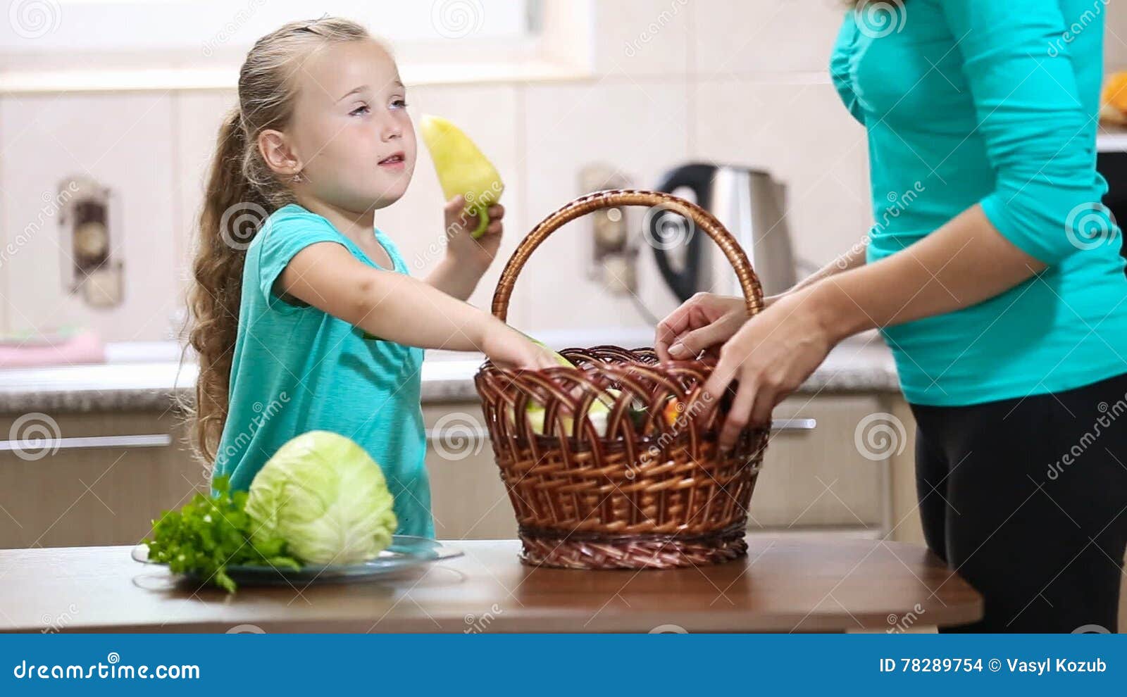 Girl Helps Her Mother Pulling Vegetables from the Basket Stock Footage ...