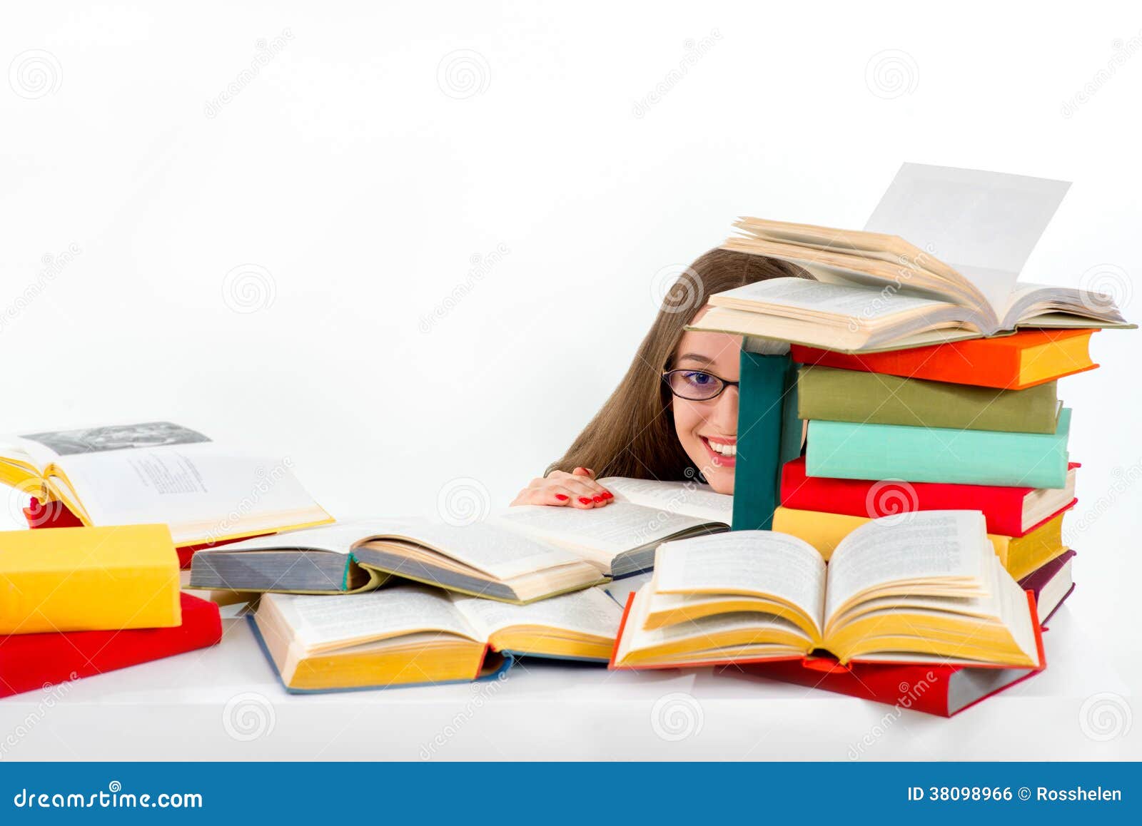 Girl Hiding Behind Stack of Colorful Books Stock Photo - Image of lying ...