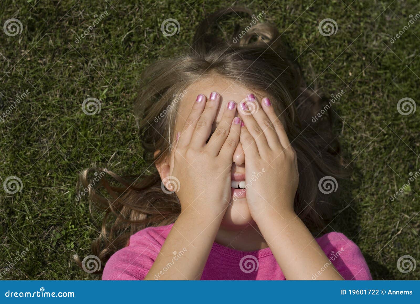 Girl hiding face stock photo. Image of grass, face, female - 19601722