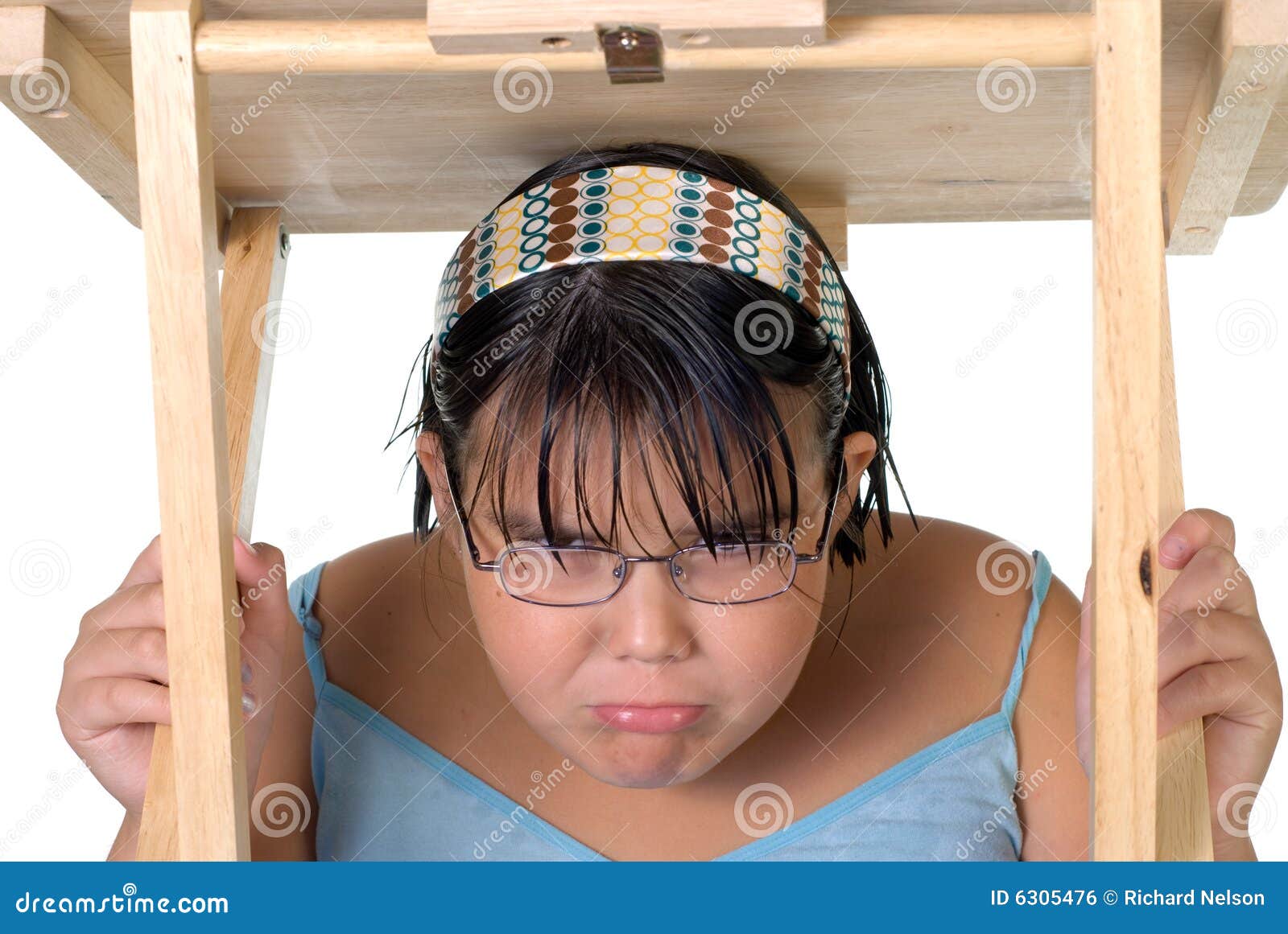 Girl Hiding Under Table stock photo. Image of scared, expression - 6305476