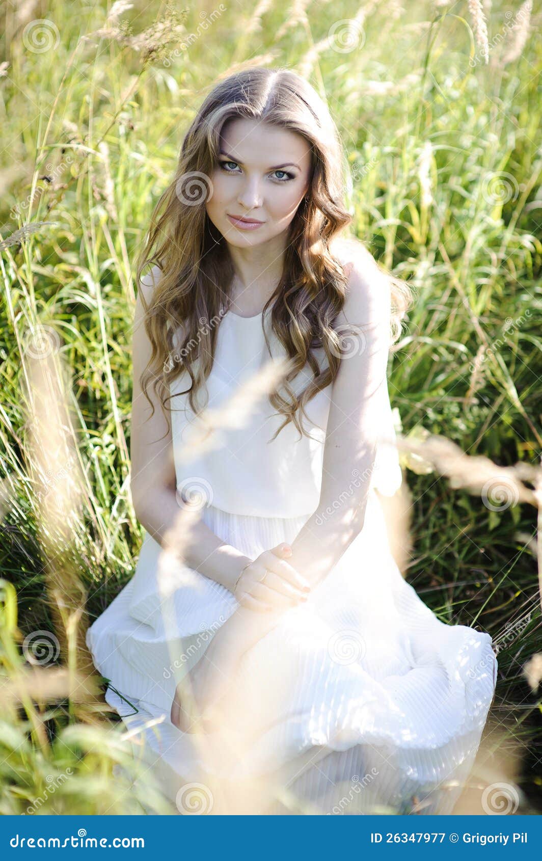 Girl in the high grass. stock image. Image of beauty - 26347977