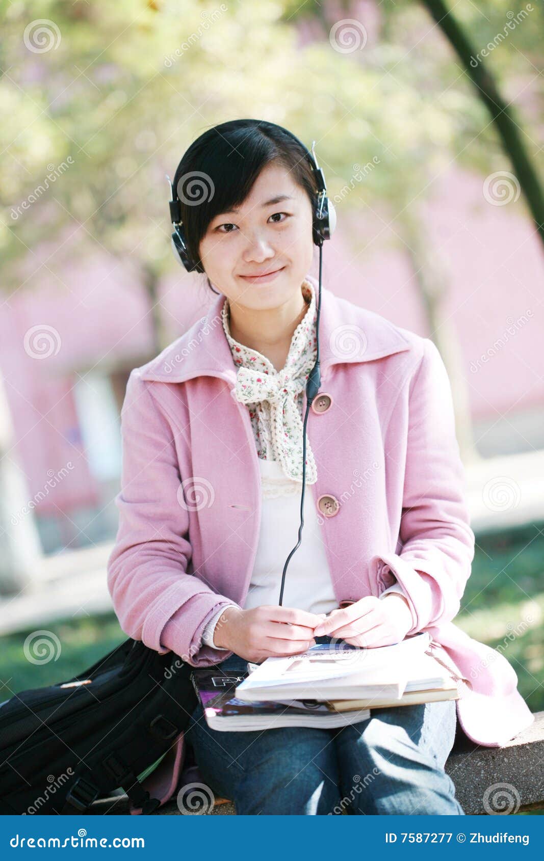 Girl hold headset and book stock image. Image of education - 7587277
