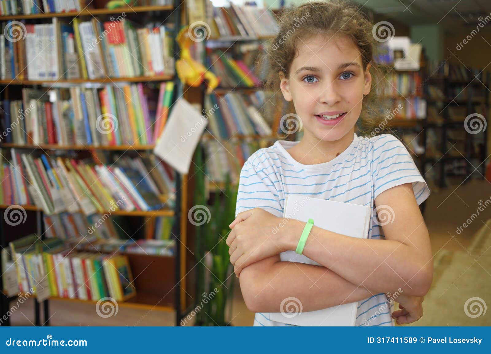 Girl Holding a Book in Childrens Stock Image - Image of bookshelf ...