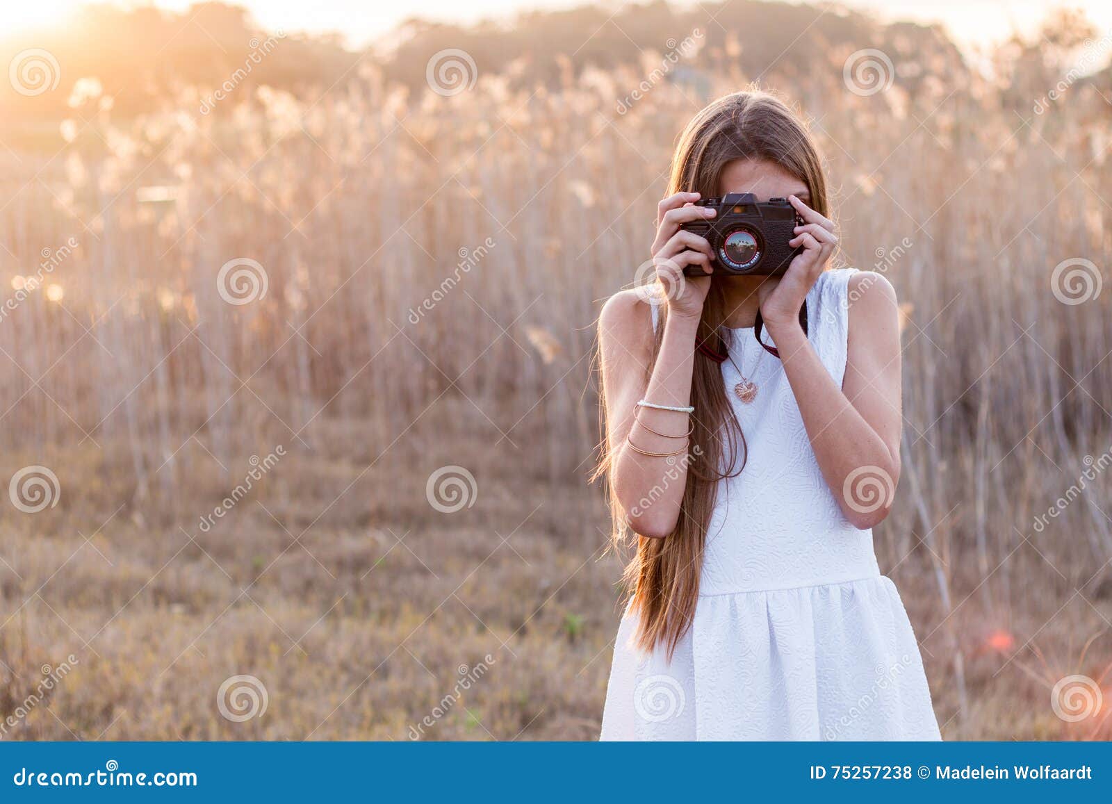 Girl Holding a Camera Taking Pictures Stock Photo - Image of front ...