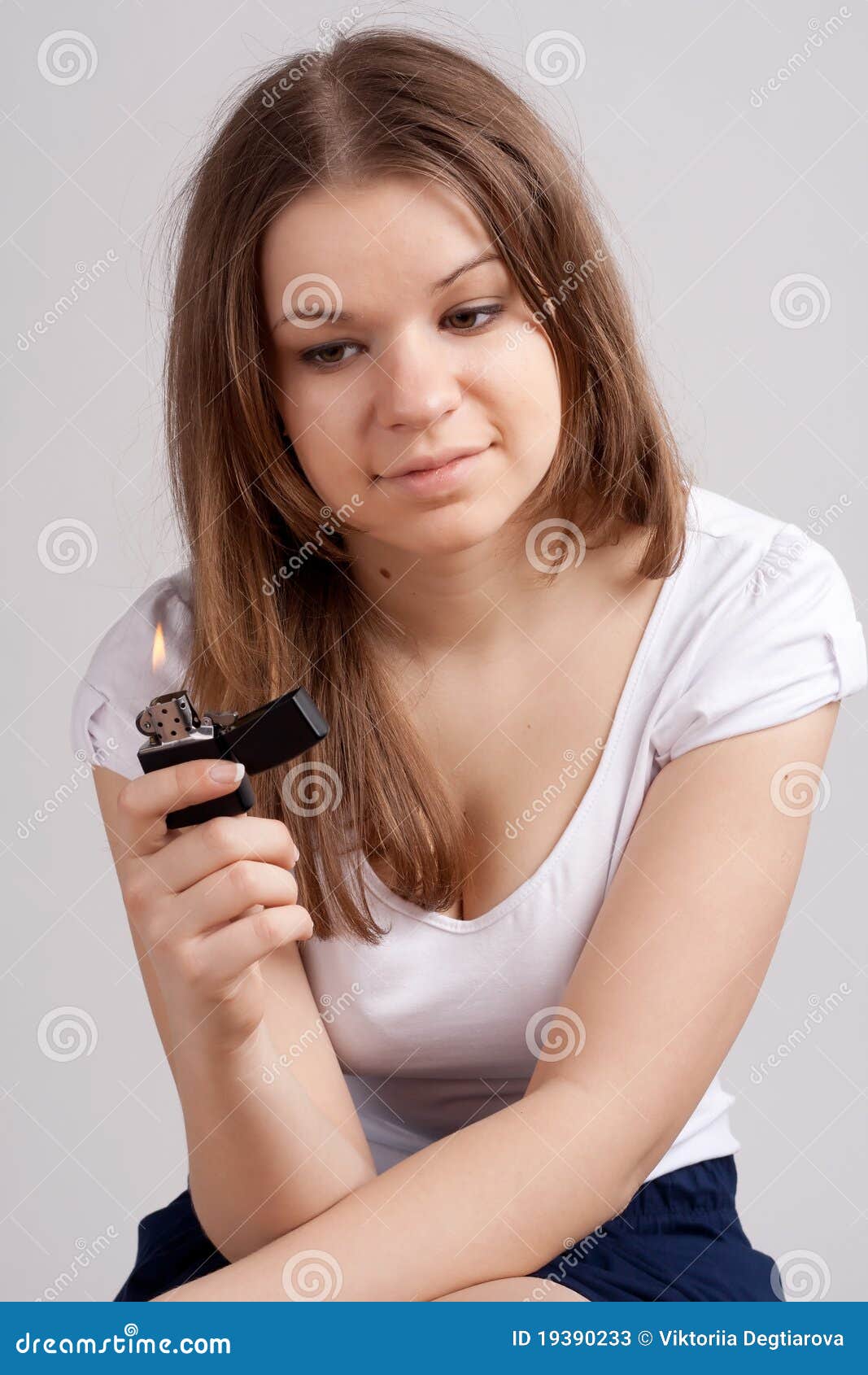 A Girl Holding a Cigarette Lighter Stock Image - Image of looking ...