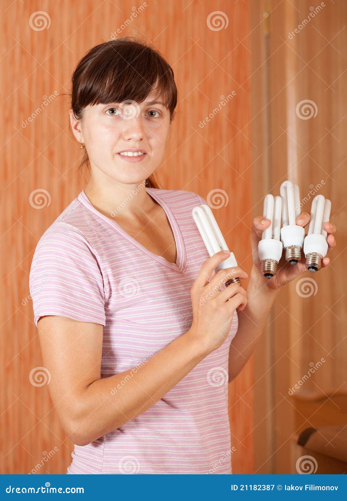 Girl holding light bulbs stock image. Image of hand, efficiency - 21182387