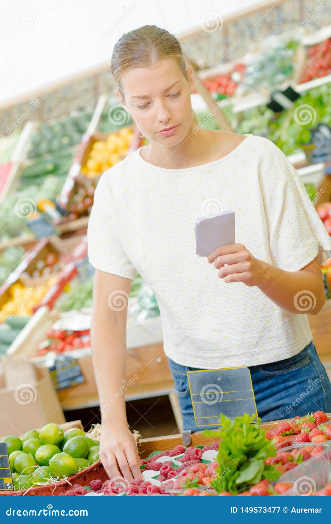 Girl holding a list stock image. Image of paper, produce - 149573477