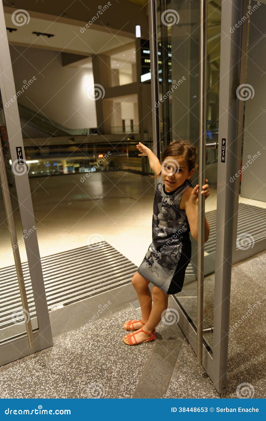 Child Holding Door Open