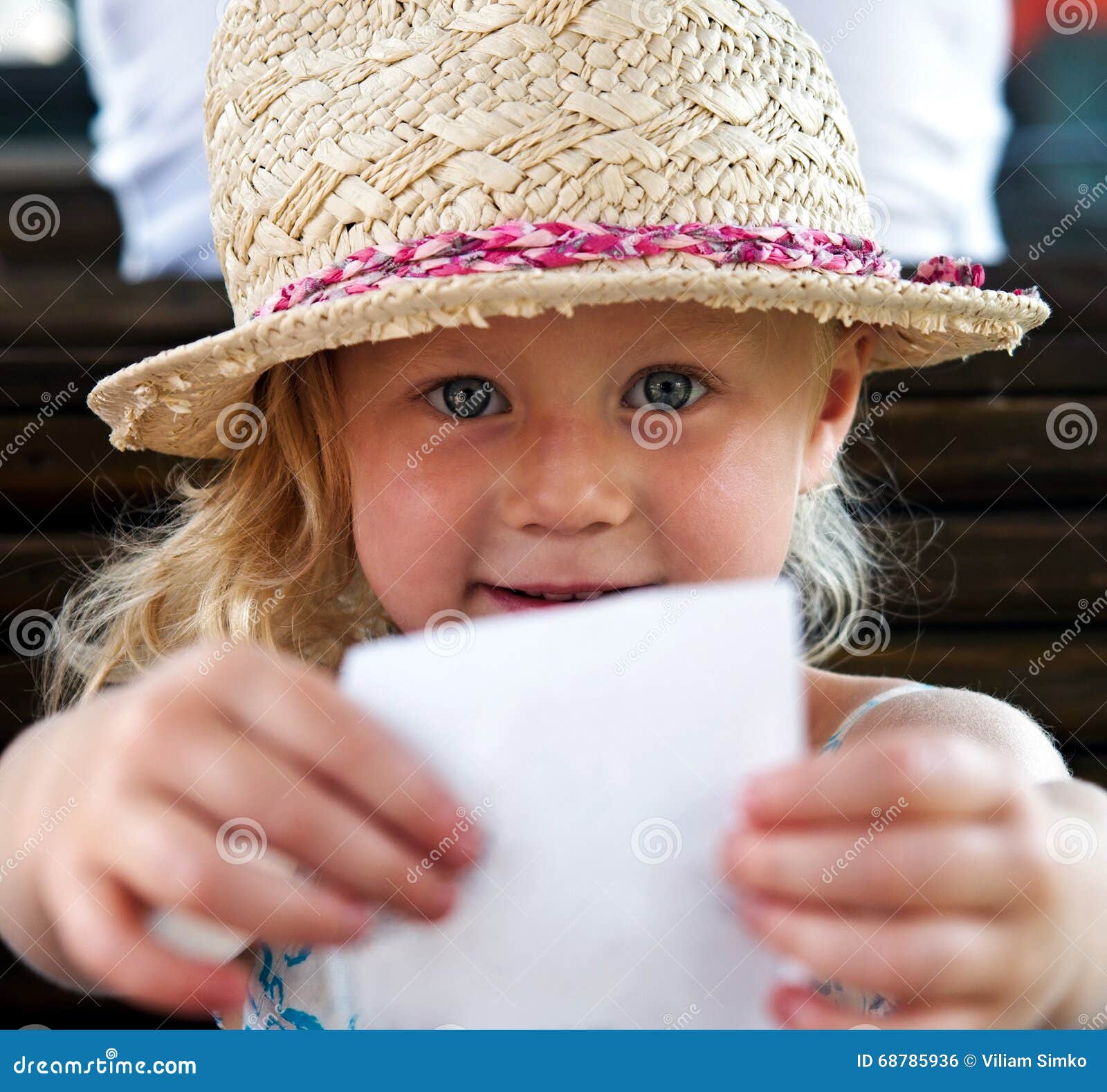 Girl holding paper stock photo. Image of girl, adorable - 68785936