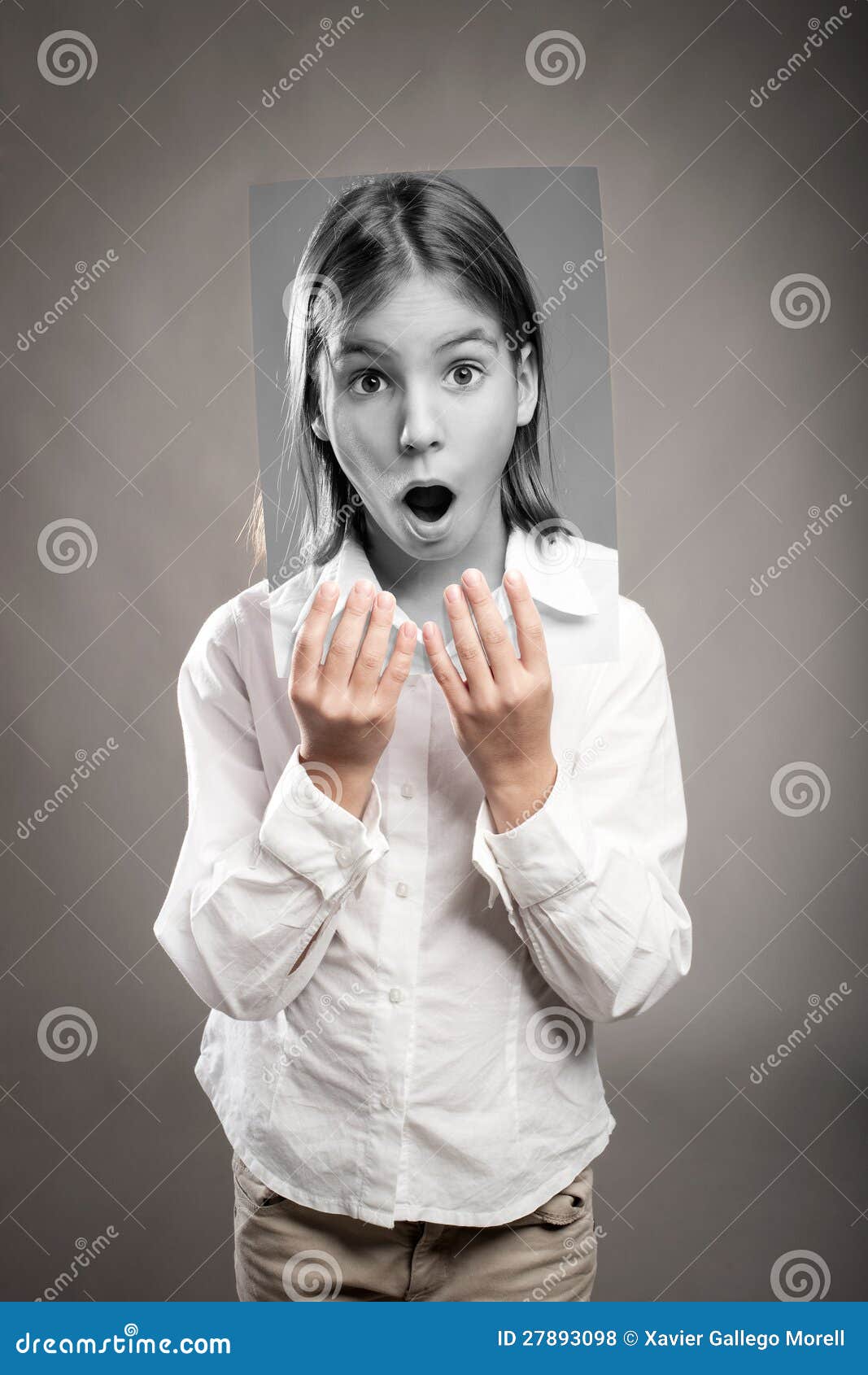 Girl Holding a Photography with Surprise Expression Stock Photo - Image ...