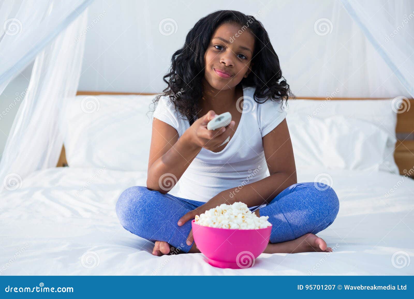 Girl Holding Remote Control while Watching Television Stock Image ...