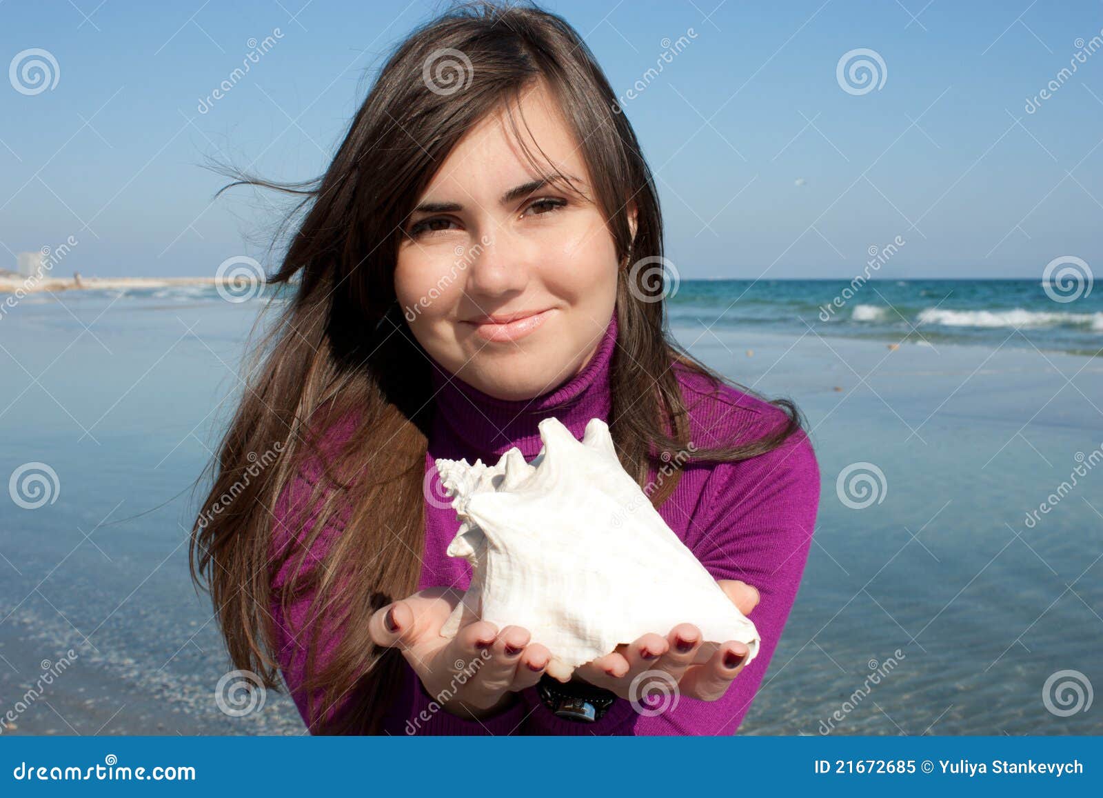 Girl holding a seashell stock image. Image of smiling - 21672685