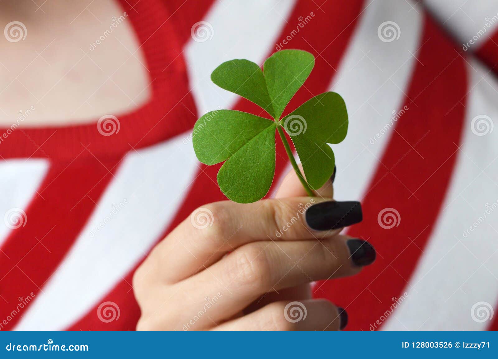 Girl holding a shamrock stock photo. Image of holiday - 128003526