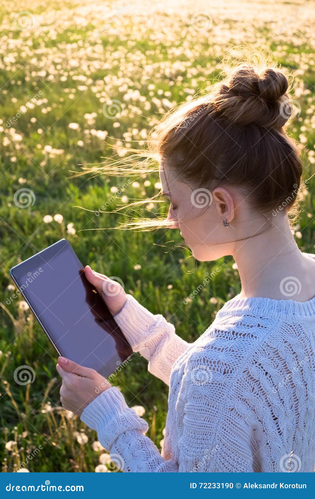 Girl Holding a Tablet Computer in the Sunset Light Stock Photo - Image ...