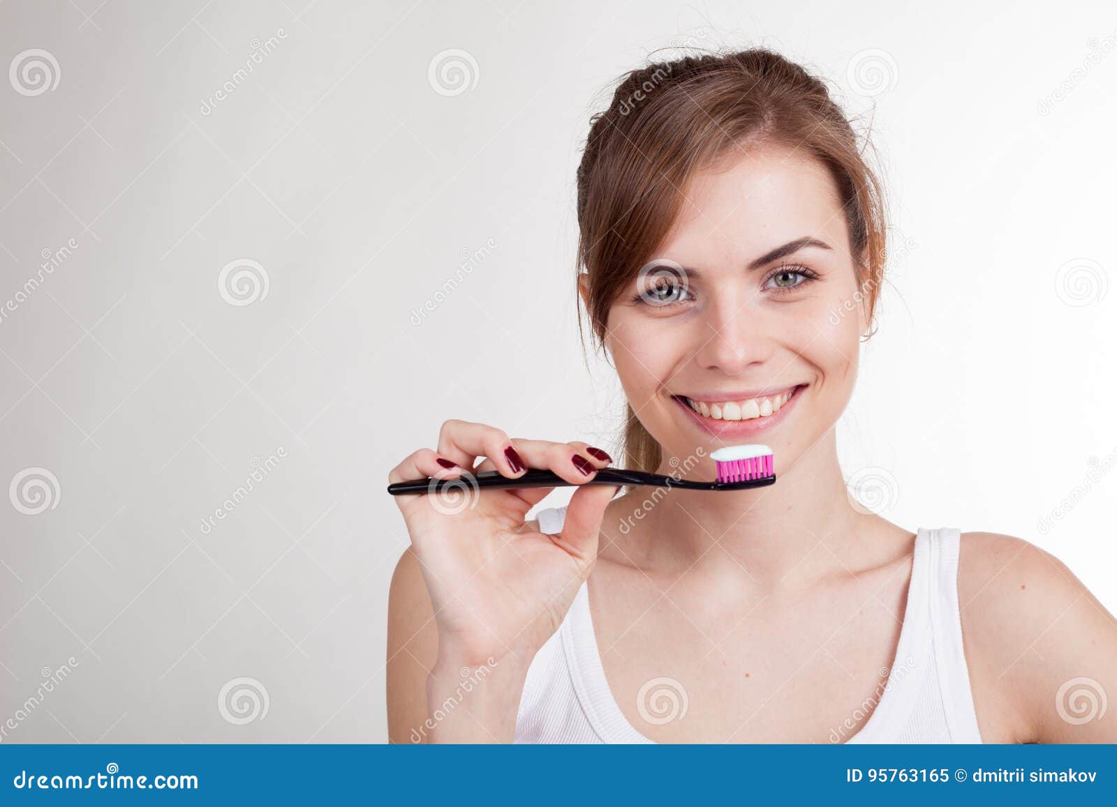 Girl Holding a Toothbrush Smiles Stock Image - Image of care, adult ...