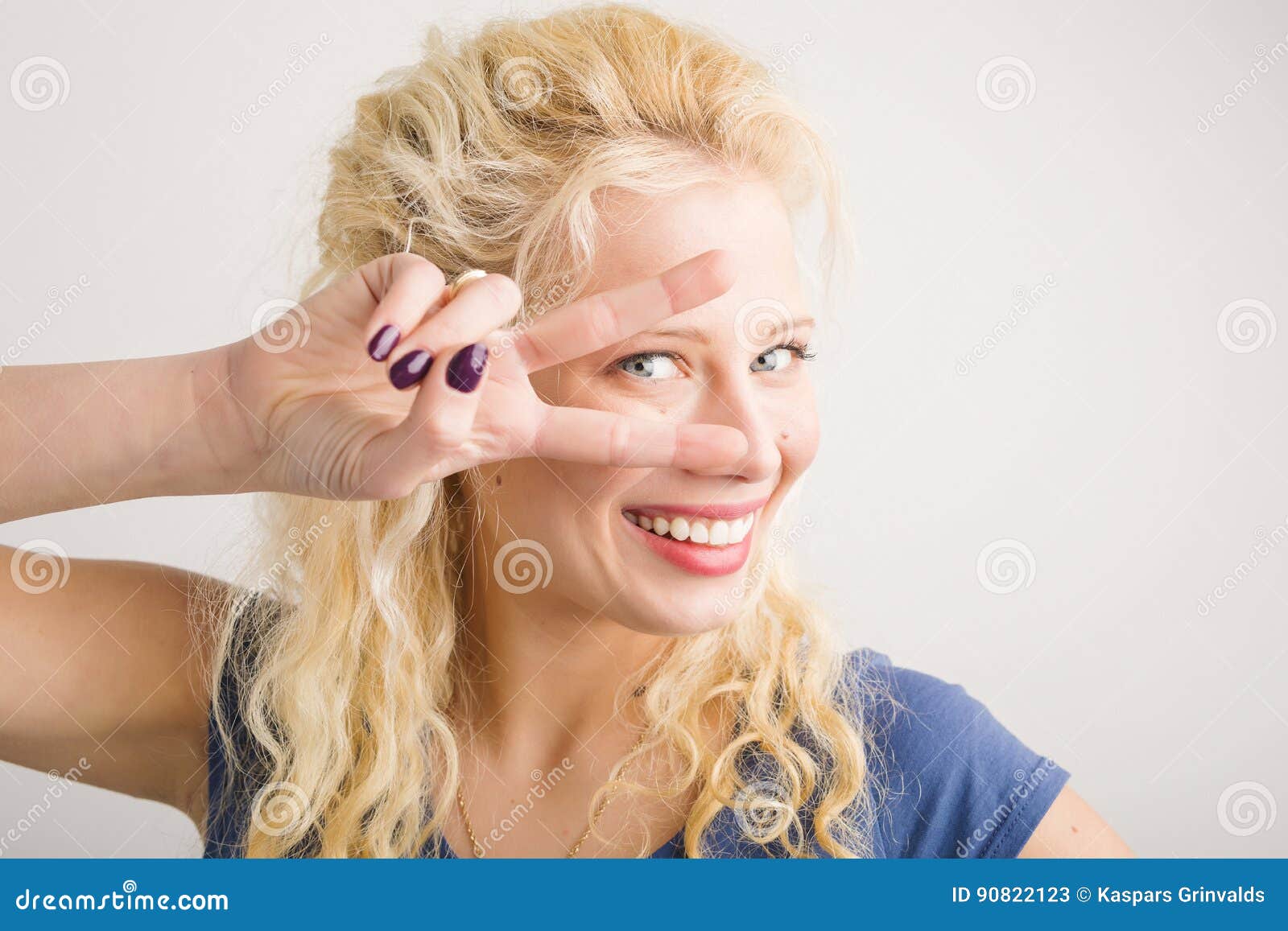 Girl Holding Two Fingers in Front of Her Face Stock Image - Image of ...
