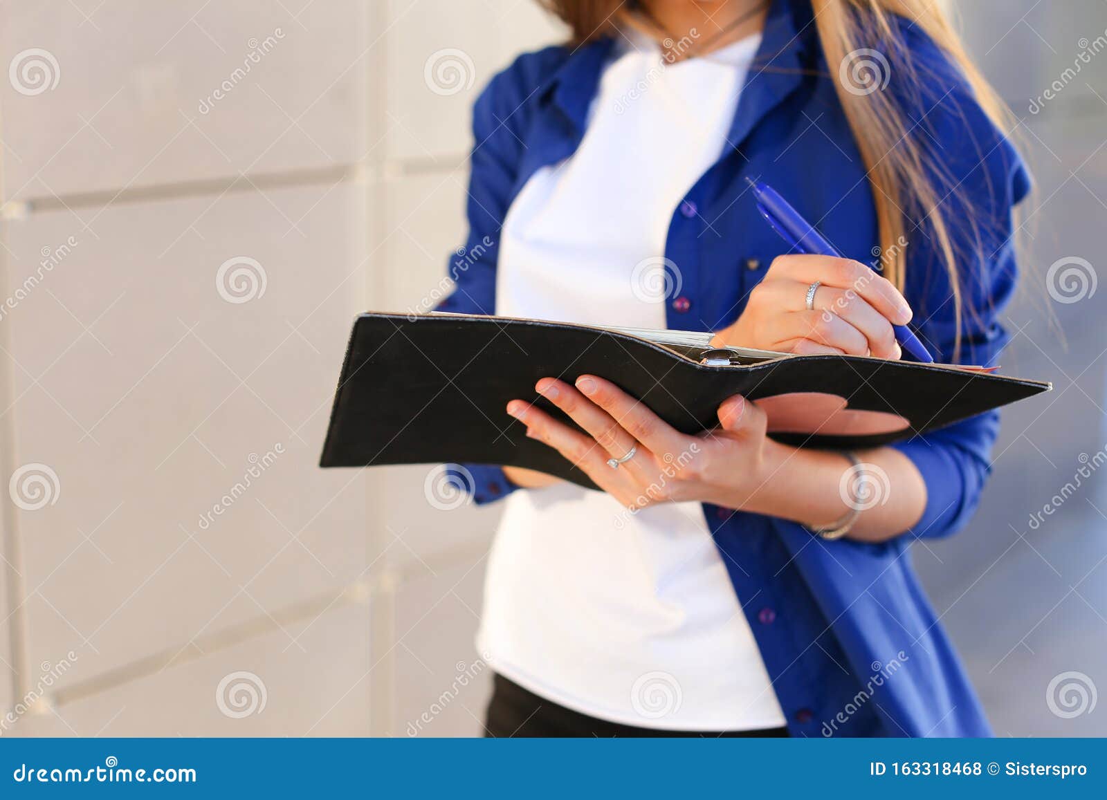 Girl Holds in Hands Diary, Notebook with Sheets and Pen and Writes in ...