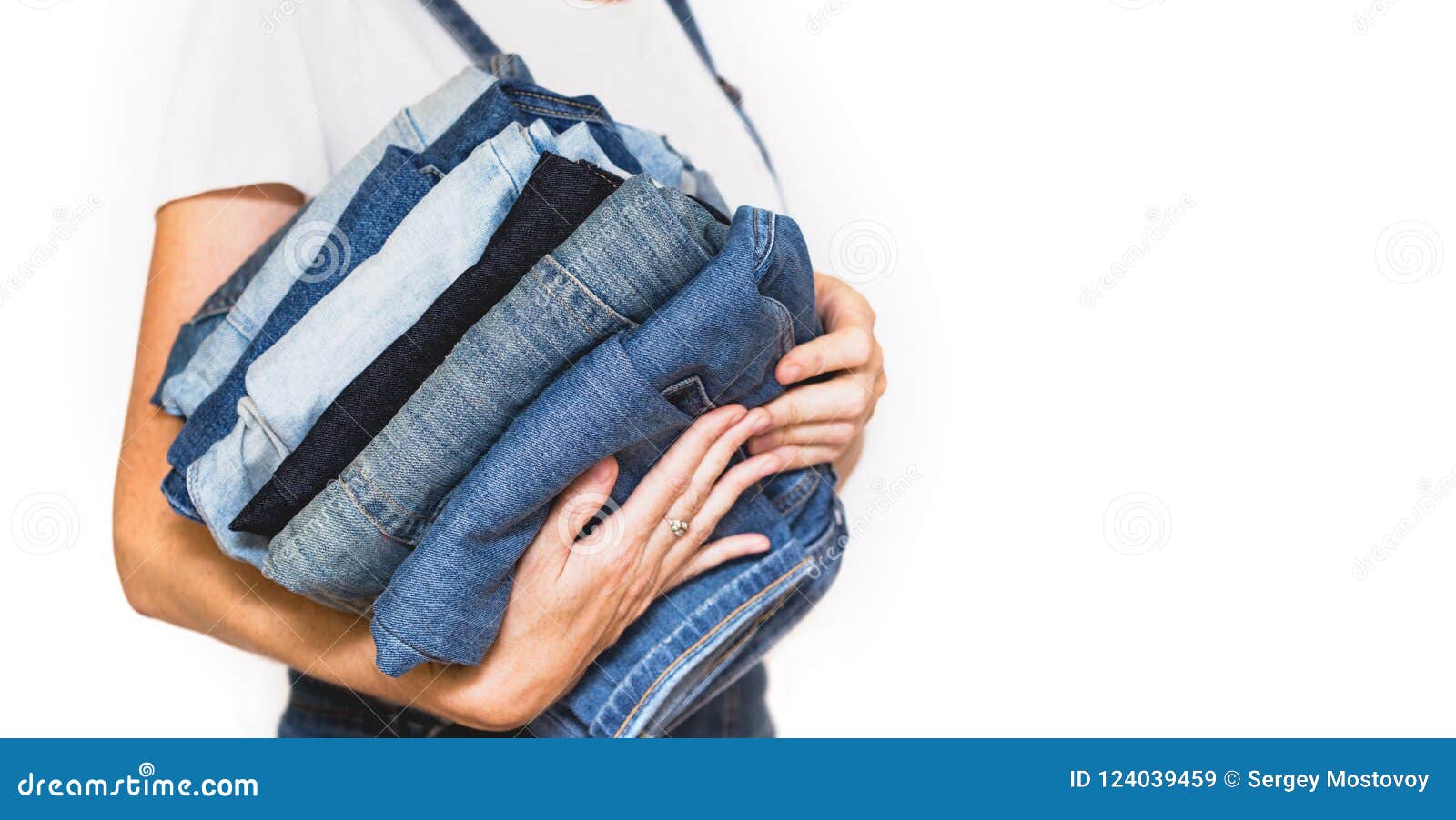 Jeans in her hands stock image. Image of attractive - 124039459