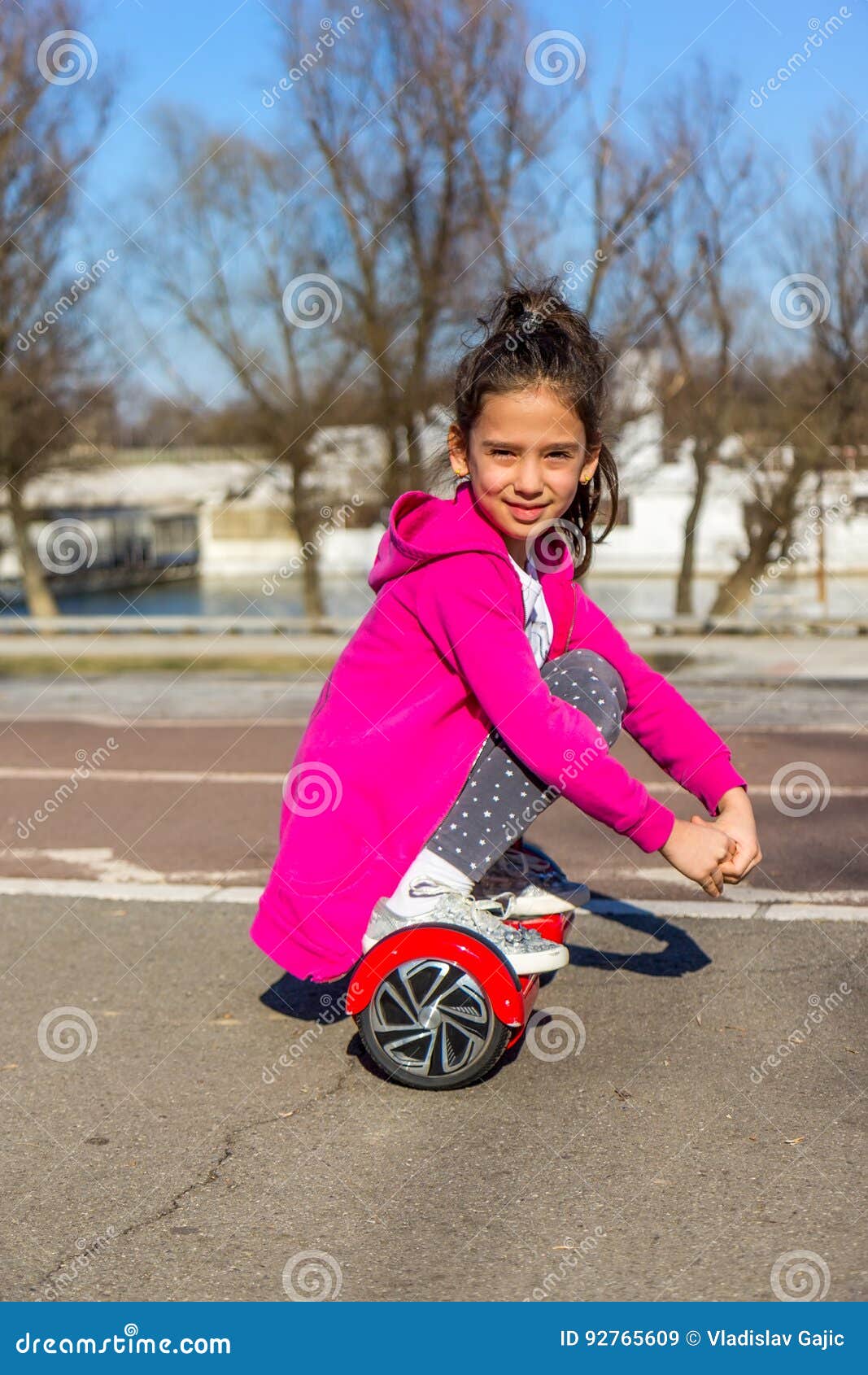 Girl on the hoverboard stock image. Image of rider, park - 92765609