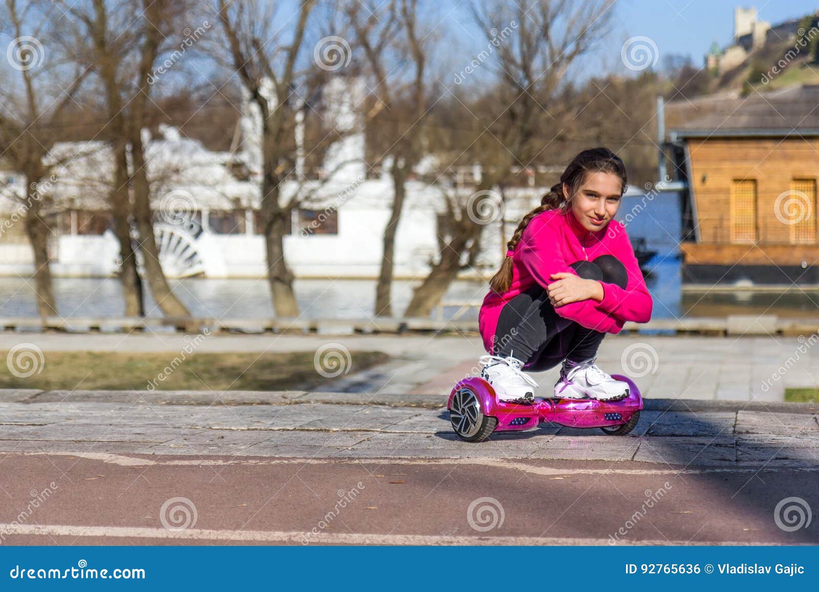 Girl on the hoverboard stock photo. Image of playground - 92765636